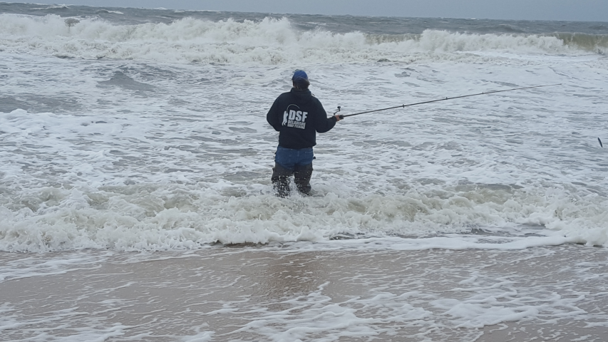Me fishing the heavy surf - delaware-surf-fishing.com