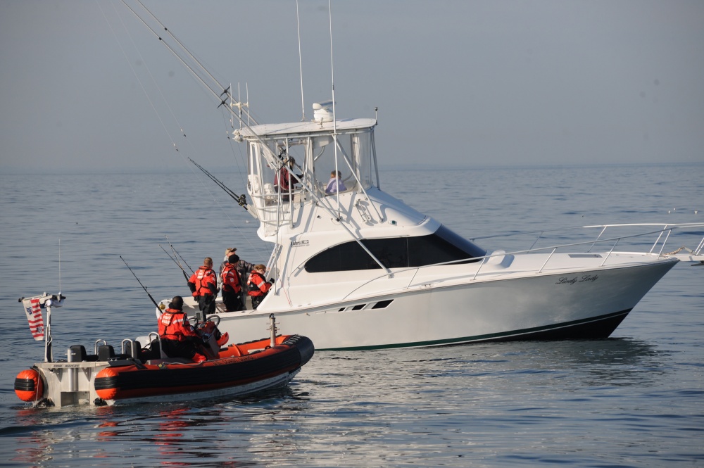 A Coast Guard boarding team from the Coast Guard Cutter Shearwater ...