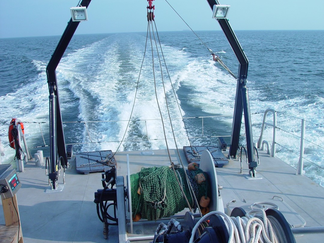 Stern of the trawl survey boat with the net rolled up and in storage ...