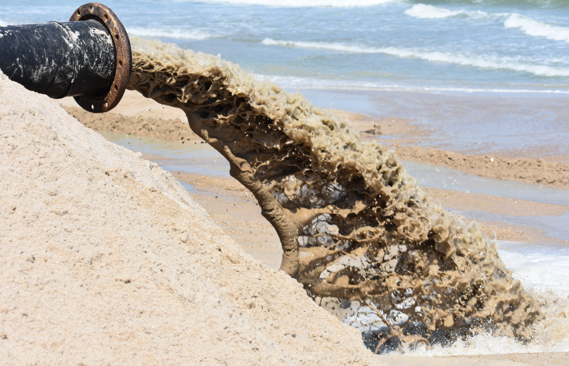 The sand relocation pipe pumping sand onto the beach at northside ...