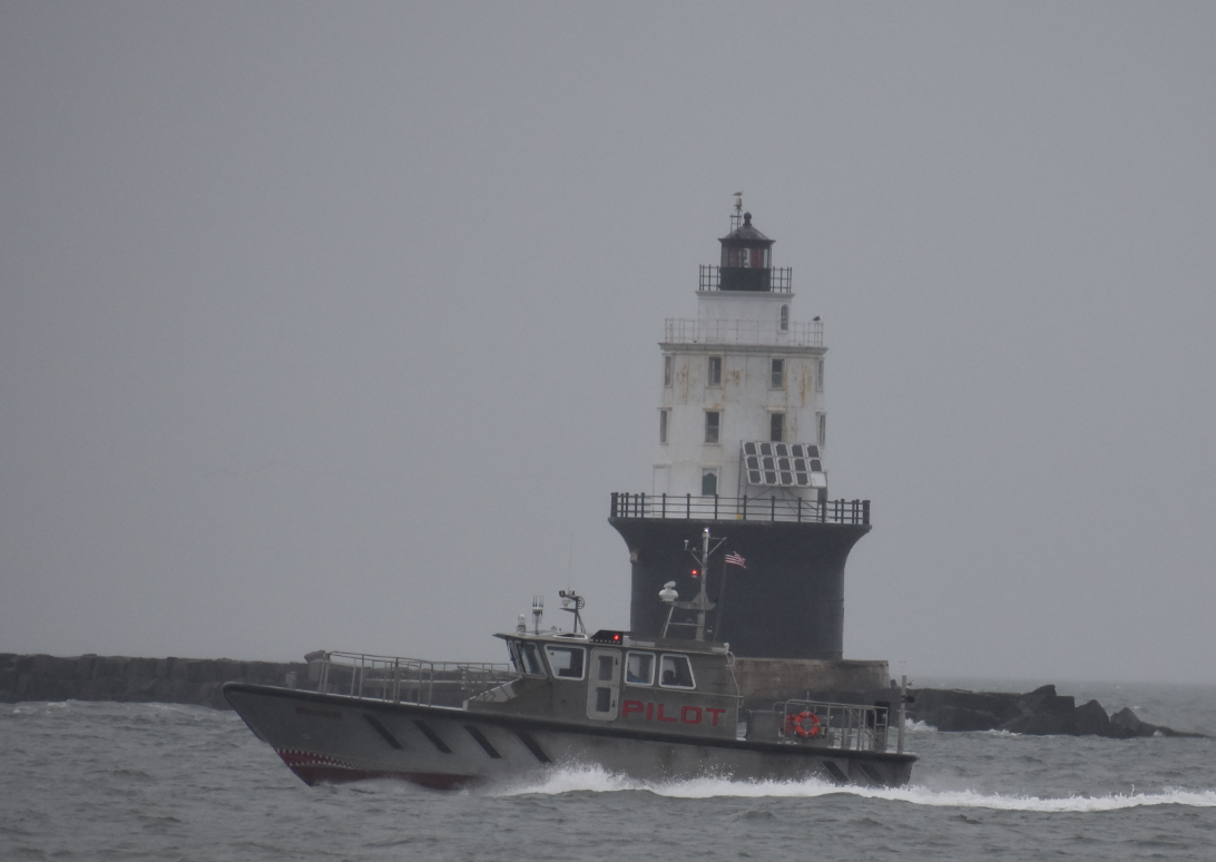 Pilot boat coming back form dropping off a river pilot in the weather ...
