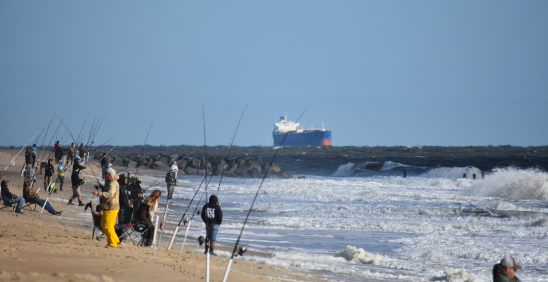 Surf anglers fishing rough conditions on Herring Point to Gordons pond ...
