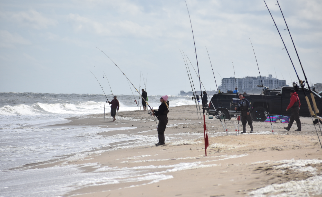 Surf anglers fishing rough conditions on Herring Point to Gordons pond ...