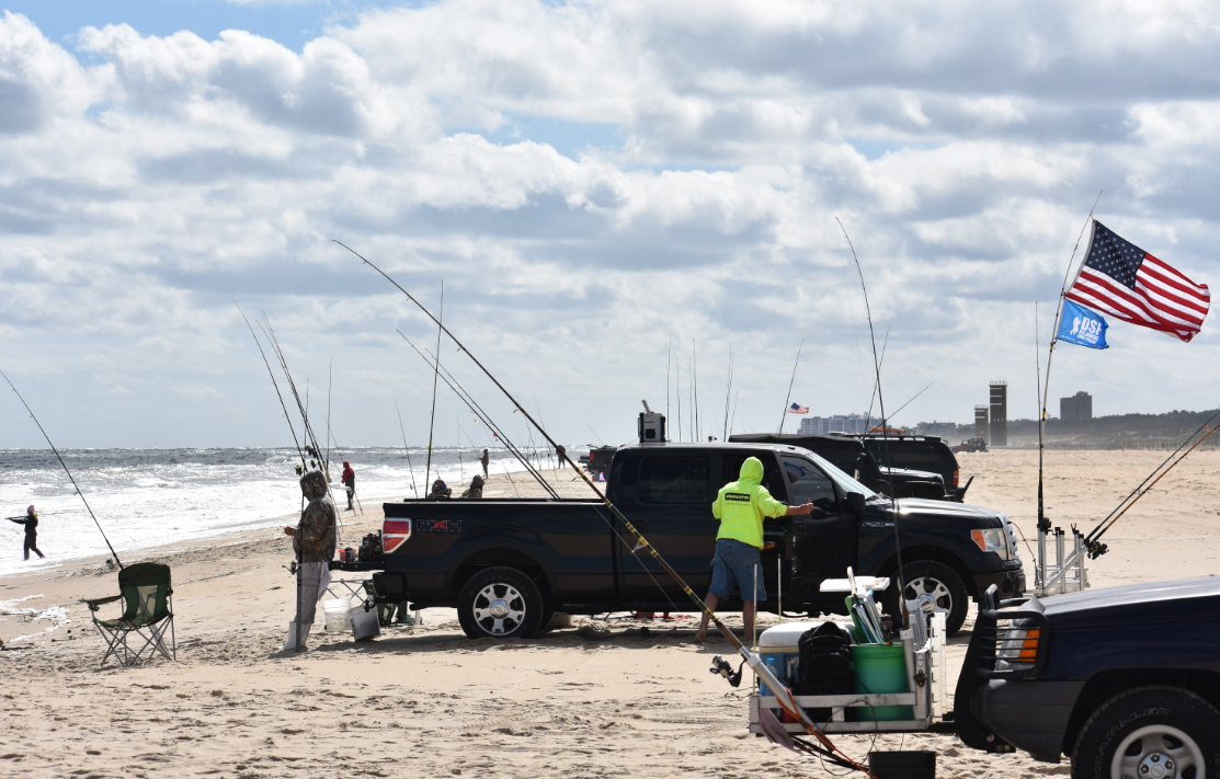 Surf anglers fishing rough conditions on Herring Point to Gordons pond ...