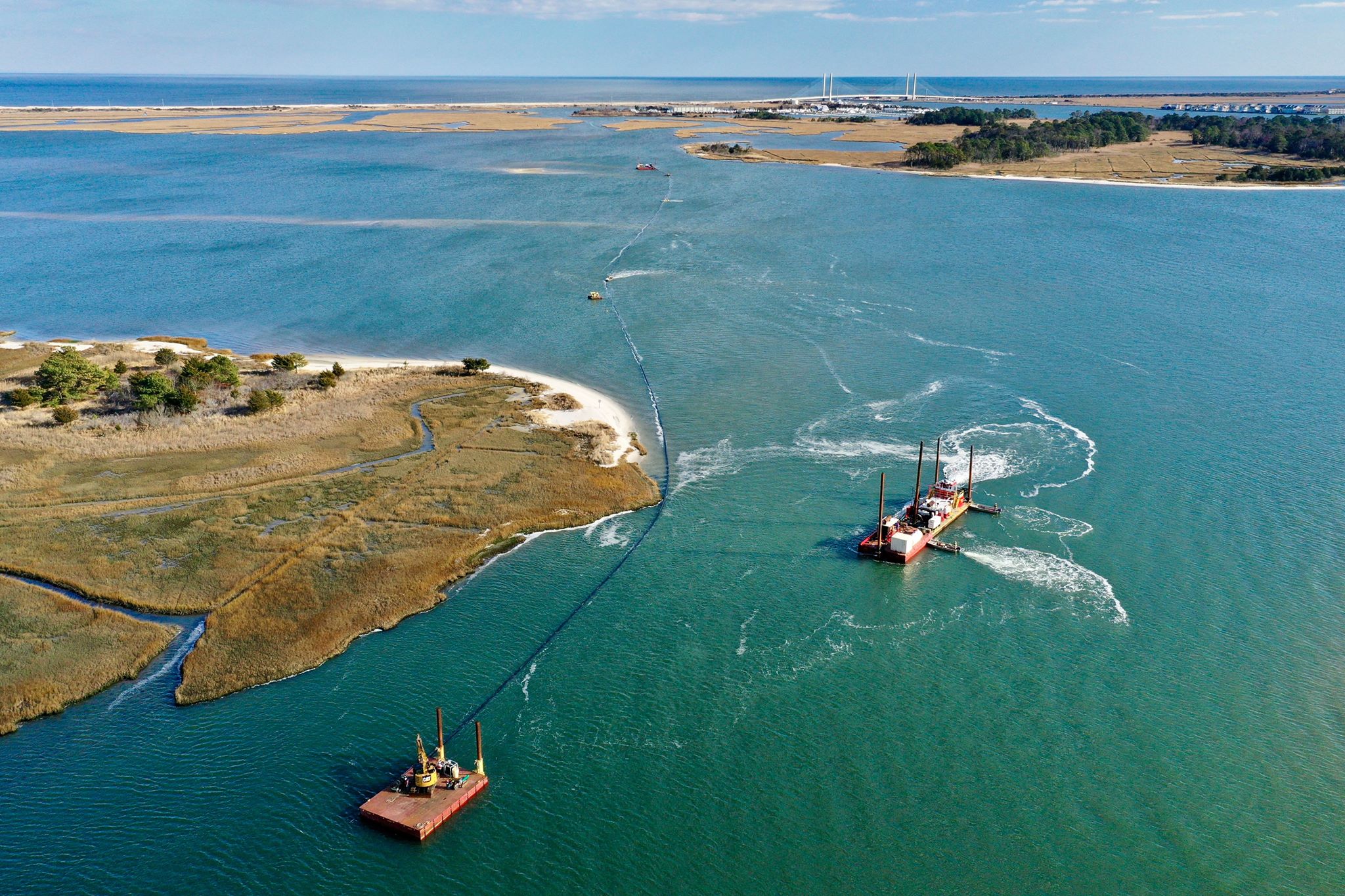 Pipe being set and headed towards the borrow pit near the Charles W ...