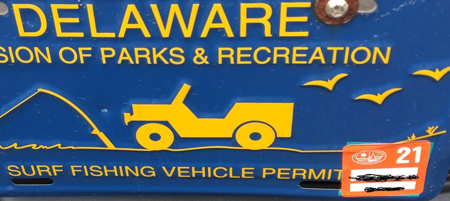 The off-peak surf tag sticker is bright orange. - delaware-surf-fishing.com