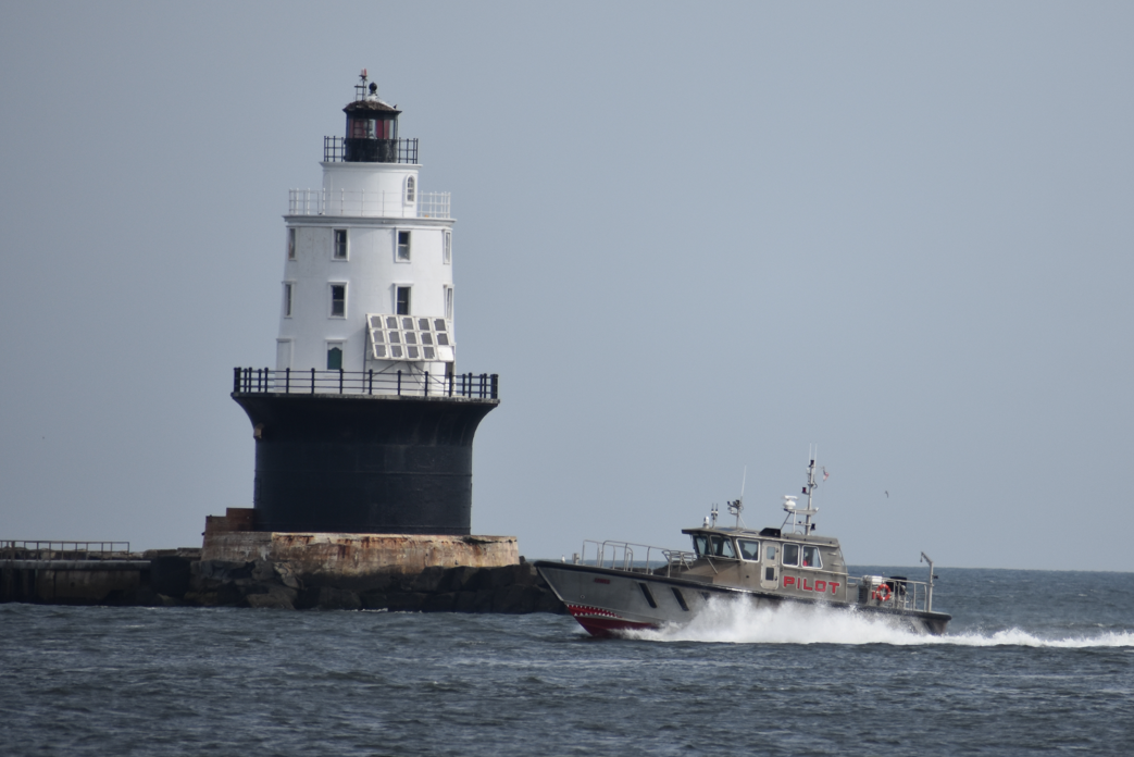 Harbor of Refuge Lighthouse and the pilot boat - delaware-surf-fishing.com