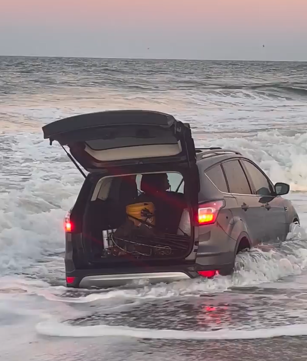 car in ocean - delaware-surf-fishing.com